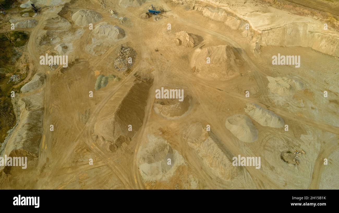 Open pit gravel mining. Large piles of construction sand and gravel ...