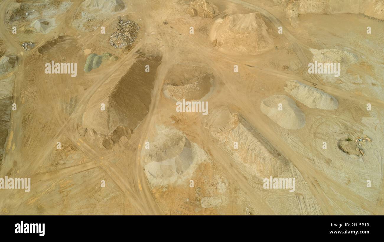 Open pit gravel mining. Large piles of construction sand and gravel ...