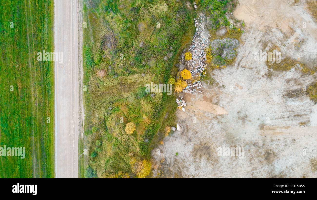 Open pit gravel mining sight with gravel field, big stones and ...