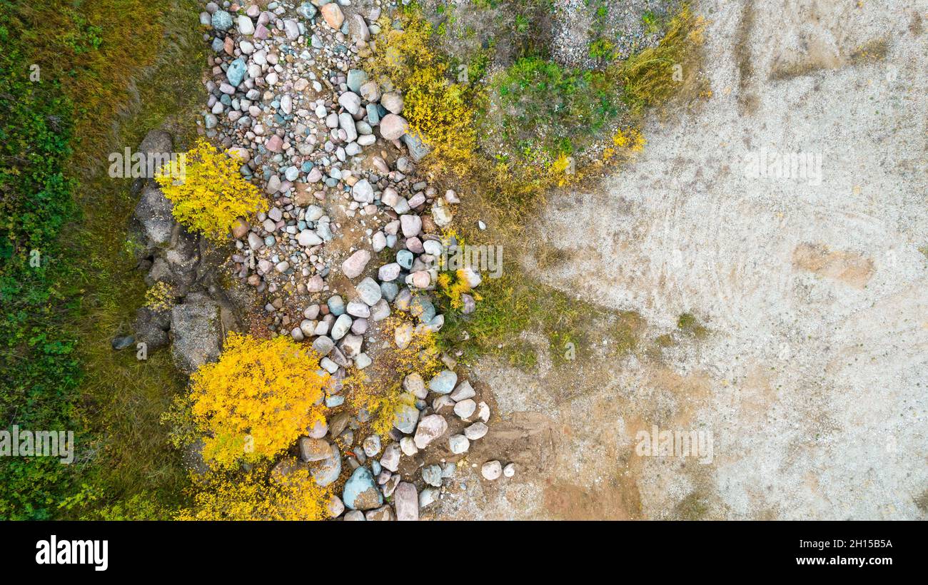 Open pit gravel mining sight with gravel field, big stones and ...