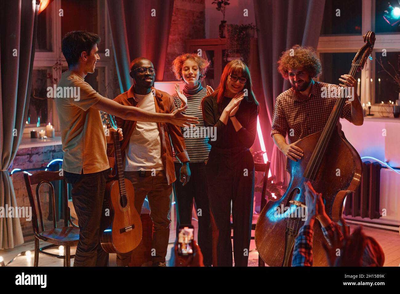 Women dancing playing musical instruments hi-res stock photography and ...