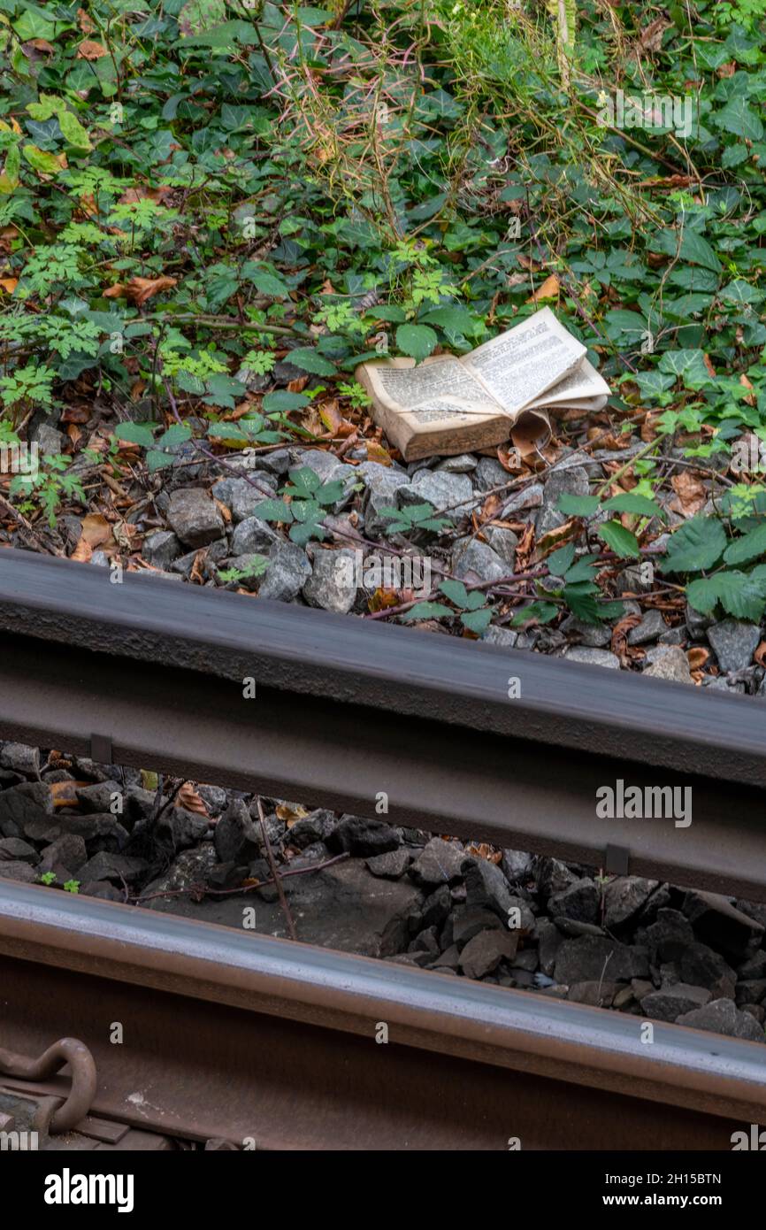 old book thrown away at a railway station close to conductor ...