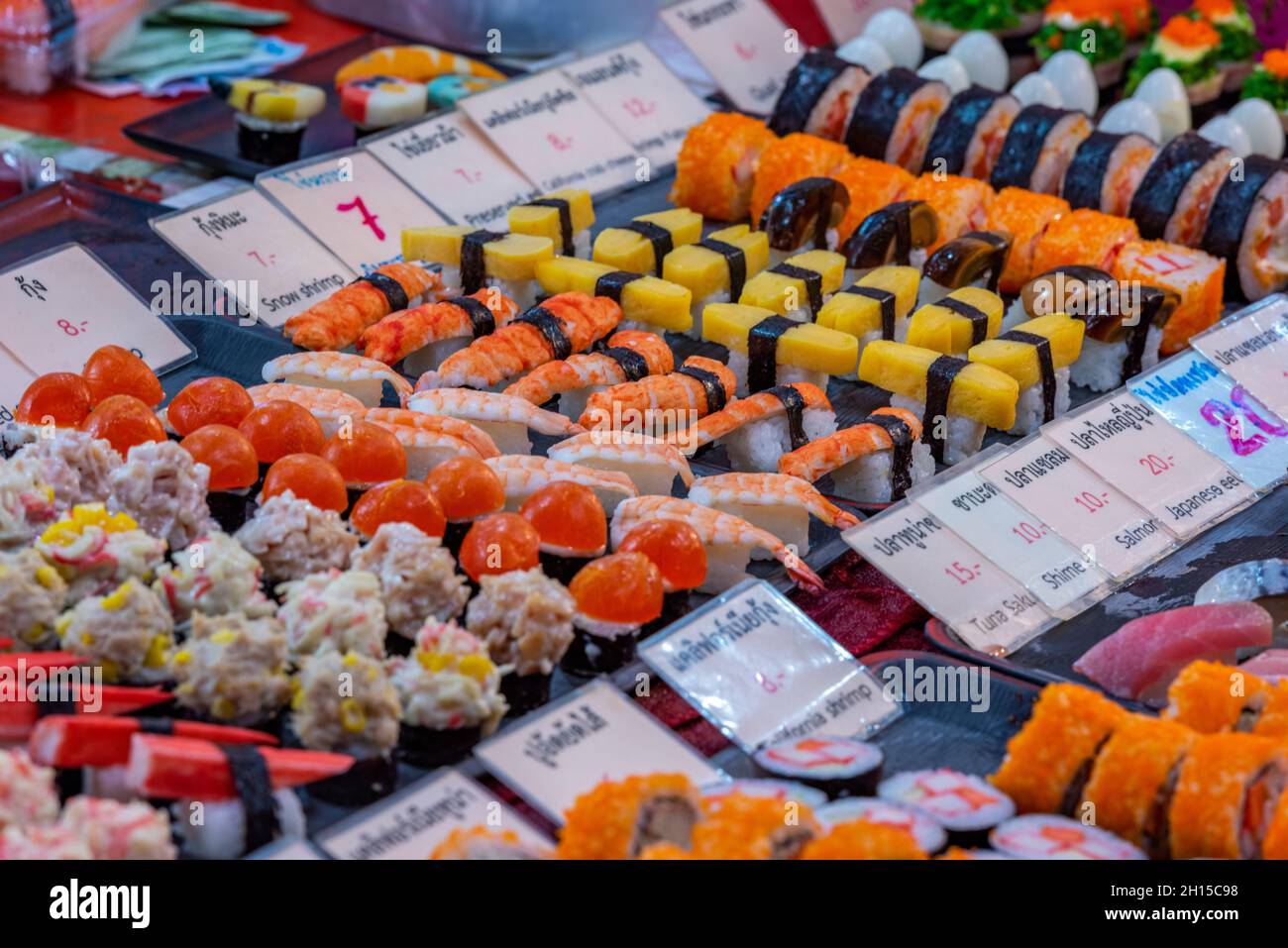 colourful japanese sushi rolls and raw fish sushi on sale on market ...