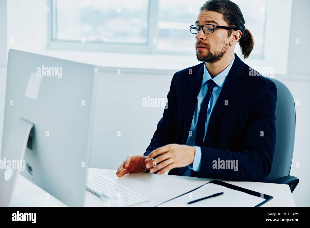 office worker with glasses self-confidence work computer Stock Photo ...