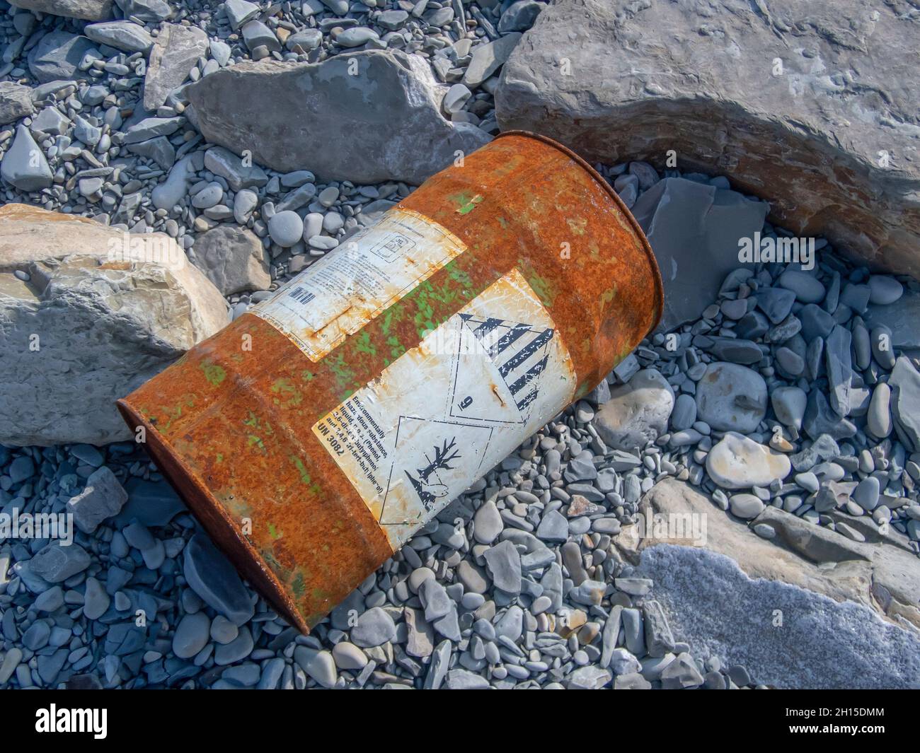 Rusty oil barrel on the seashore. Environmental pollution Stock Photo ...