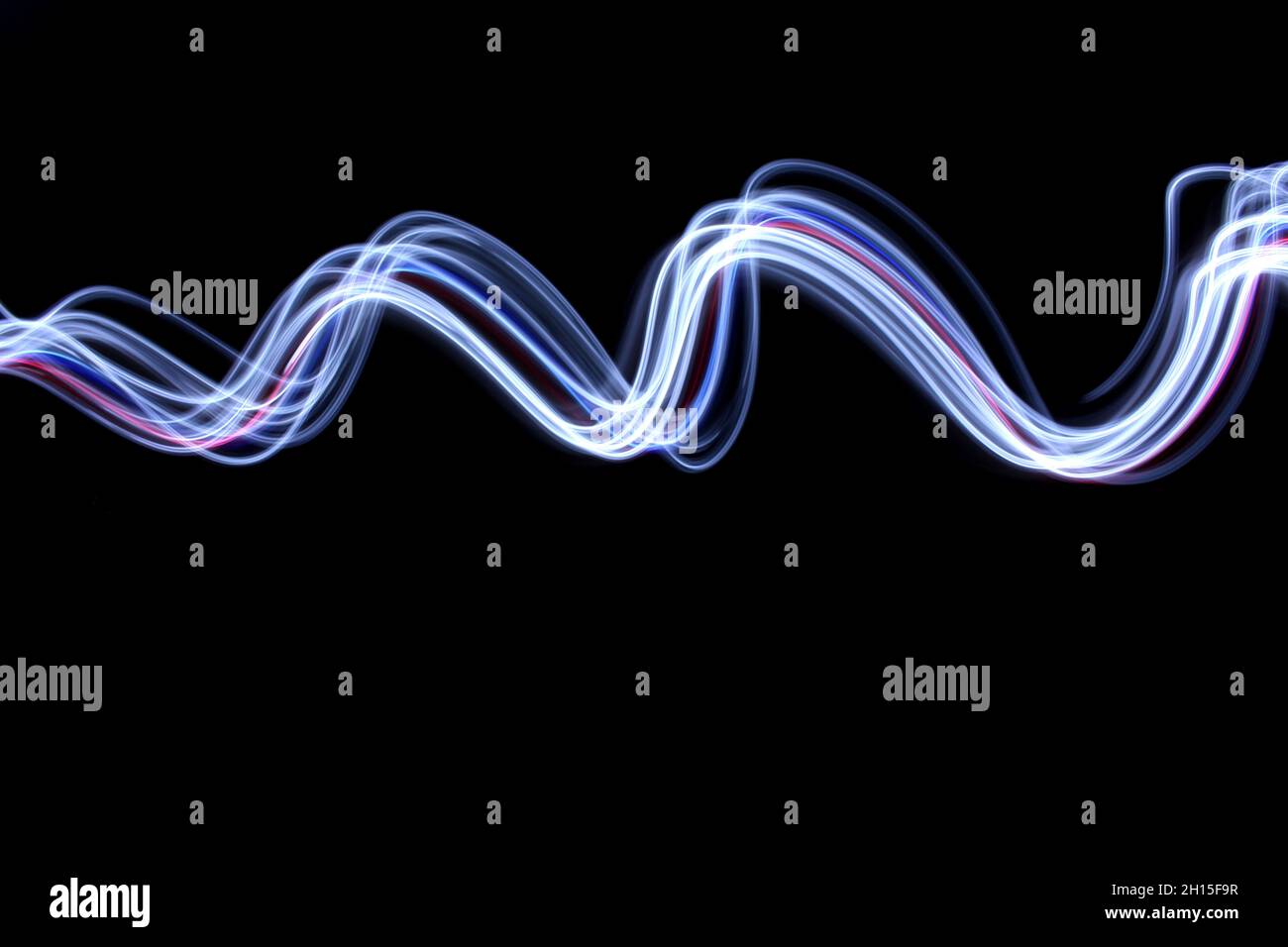 Long exposure light painting photograph of neon colour fairy lights in ...