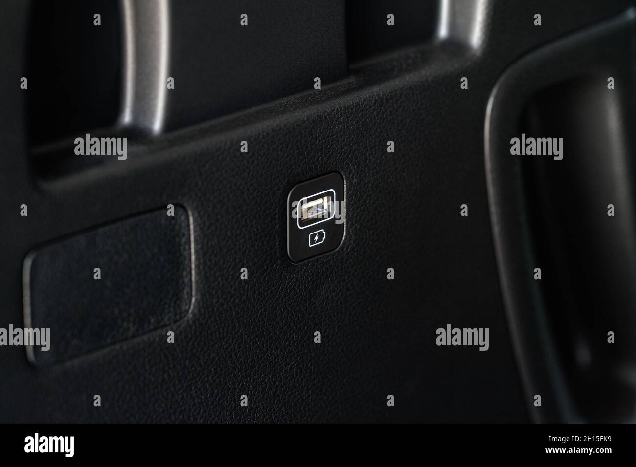 Opened car USB port in the car for connecting device. Power output of ...