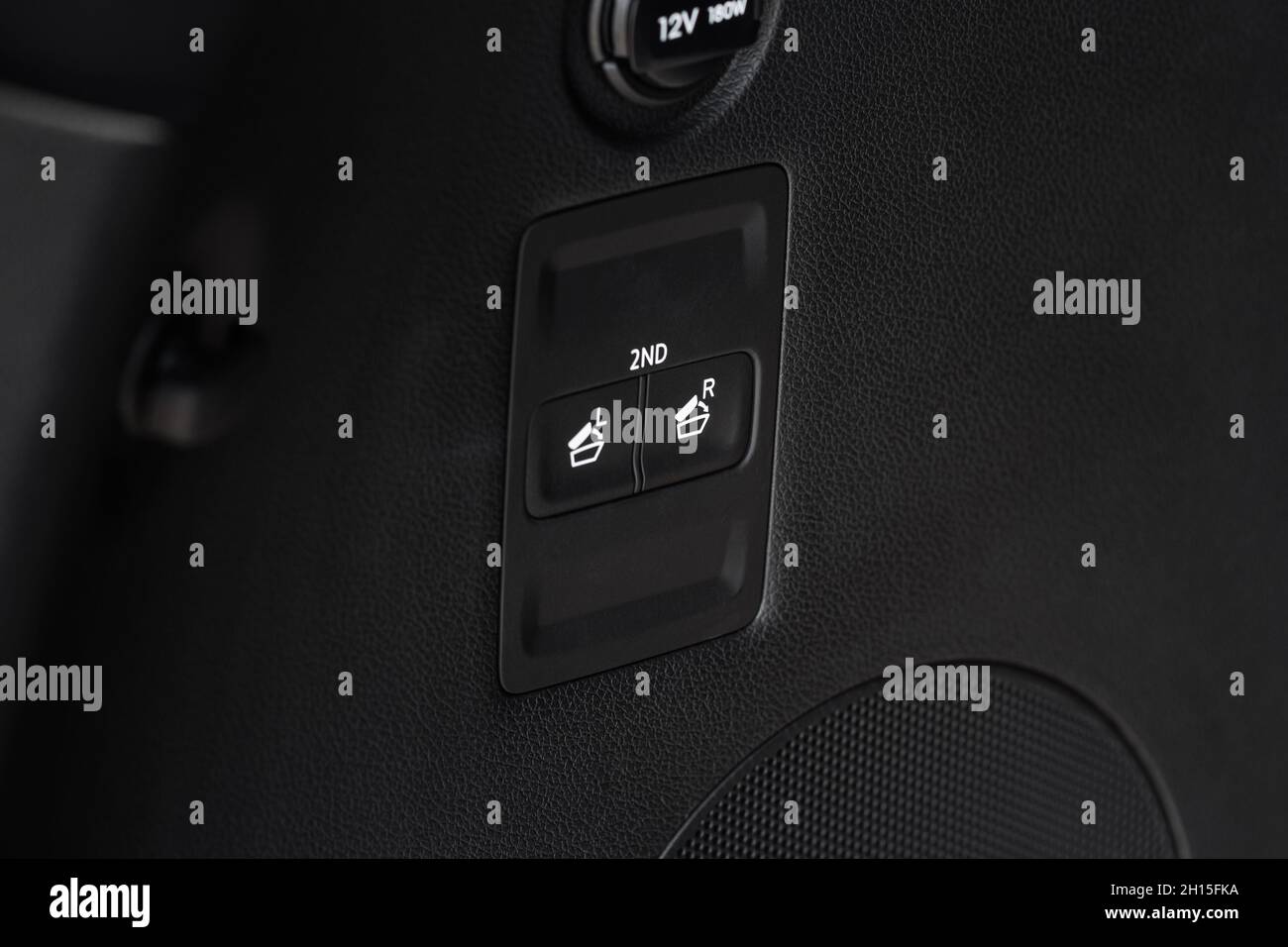 Folding second row seat button Stock Photo - Alamy