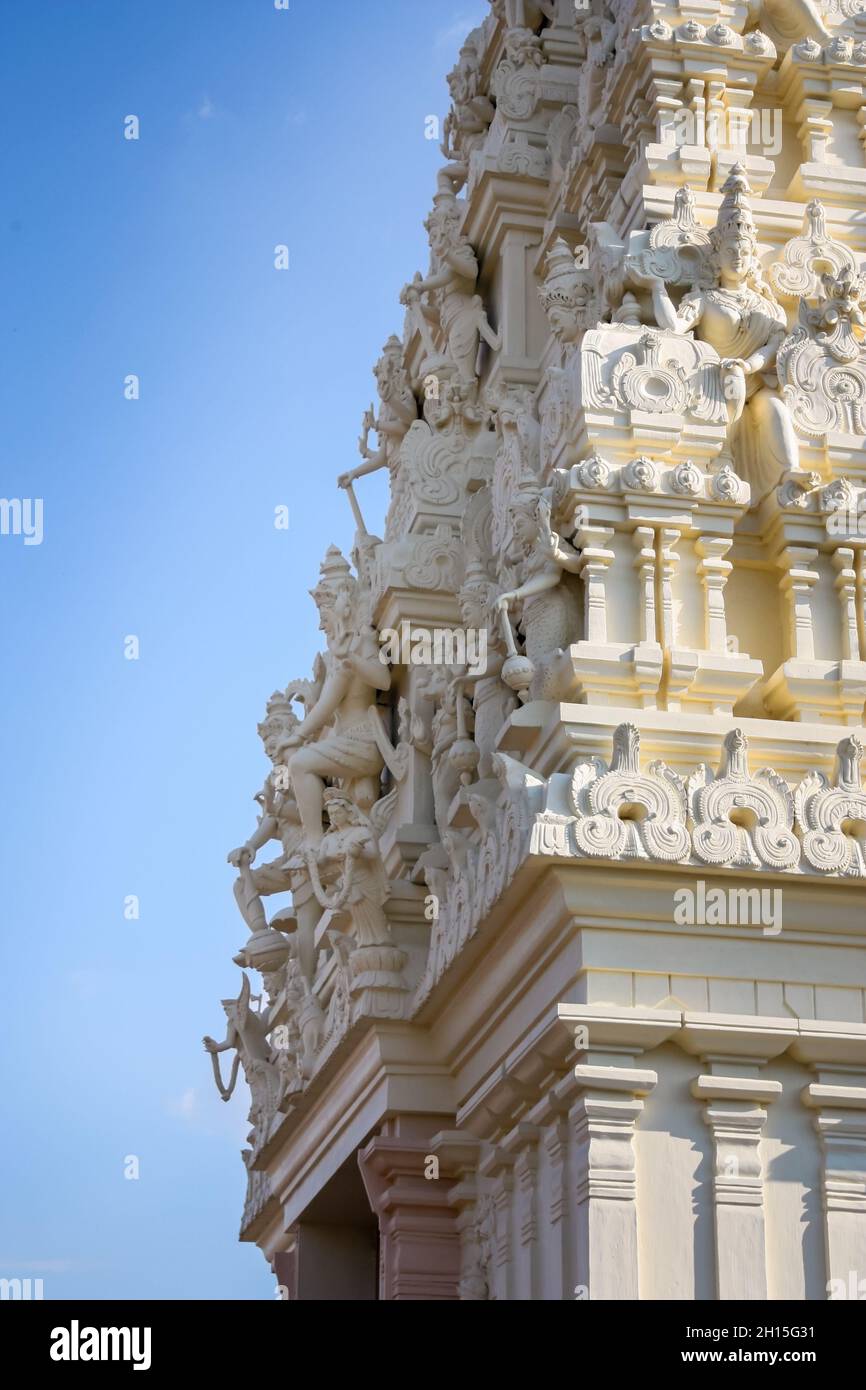 Detail of a roof of a hindu temple against the blue sky Stock Photo - Alamy