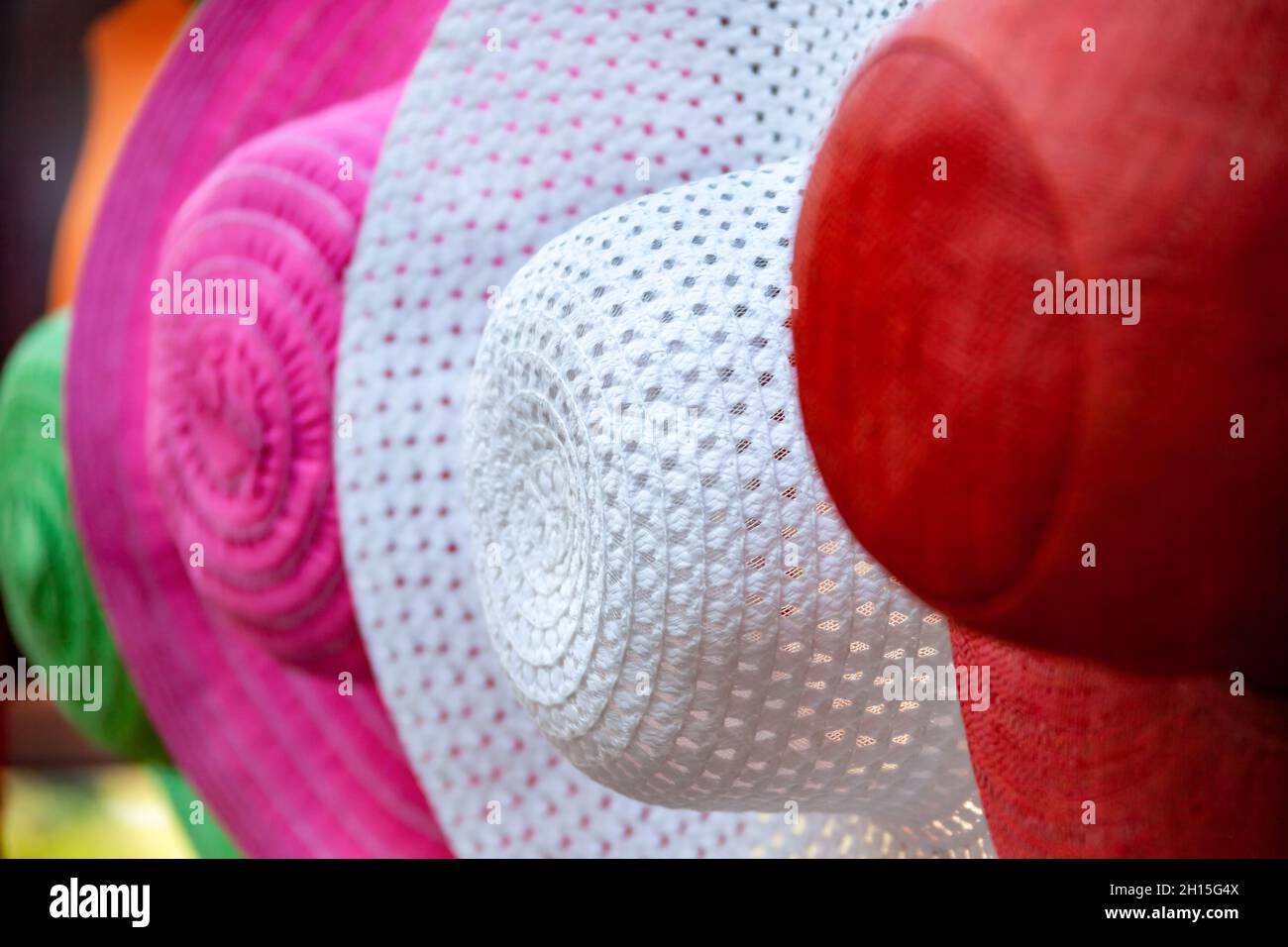 Straw and textile hats various colors and sizes Stock Photo - Alamy