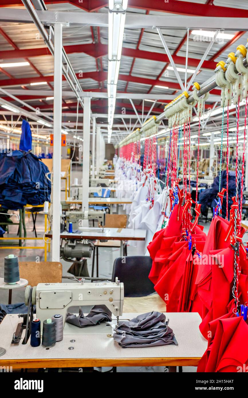 Small entrepreneur in Africa, Botswana, industrial textile factory manufacturing safety gear ...