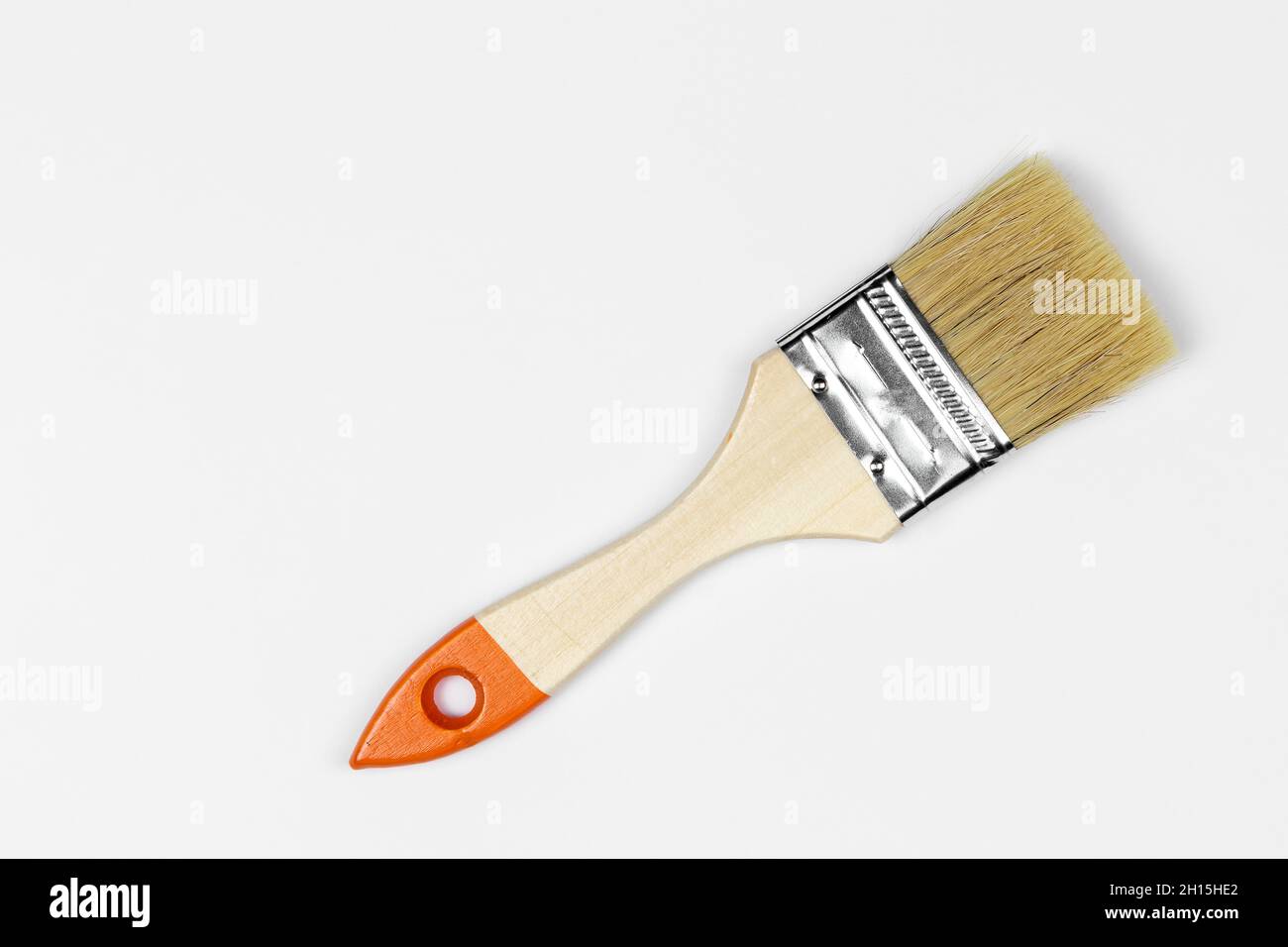 paint brush close-up against a white background, natural shadow, copy ...