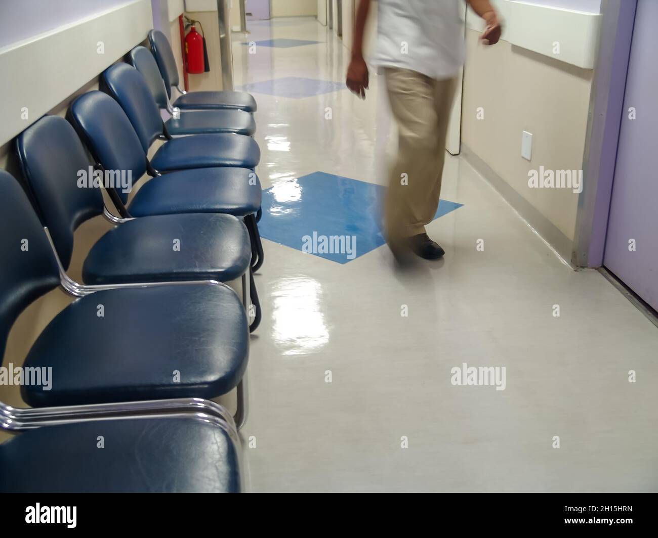 Generic hospital hallway, African doctor walking Stock Photo - Alamy