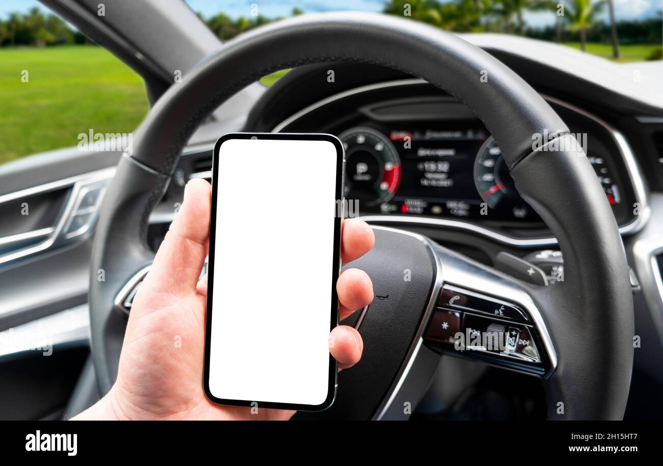 Driver hand using smartphone in car. Smartphone in a car use for ...