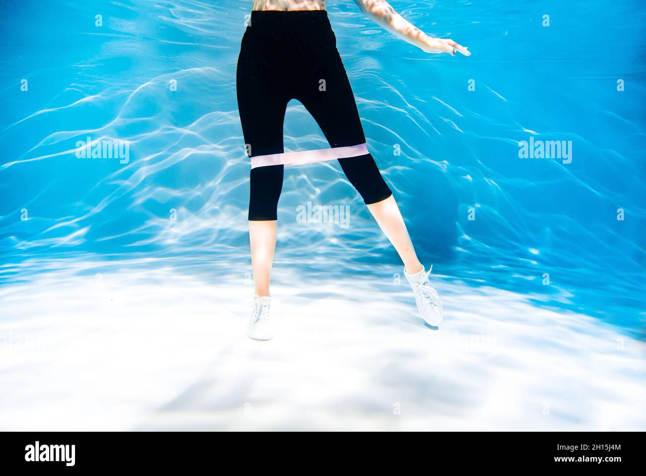 Running woman jogging. Girl under water, freshness and lightness ...