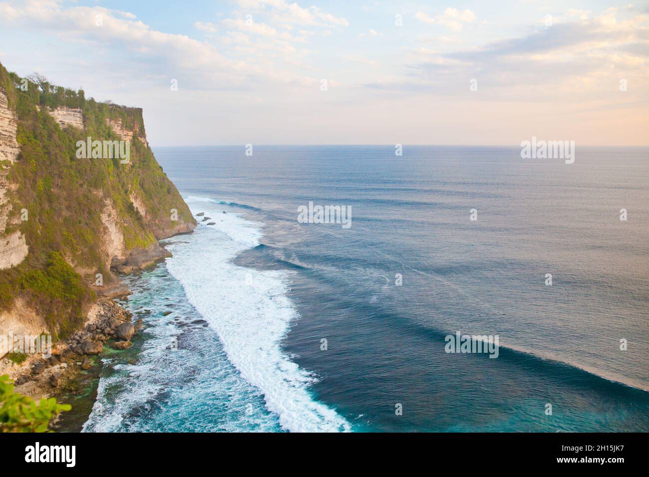 View of Uluwatu cliff with blue sea in Bali, Indonesia. Rocky cliff and ...
