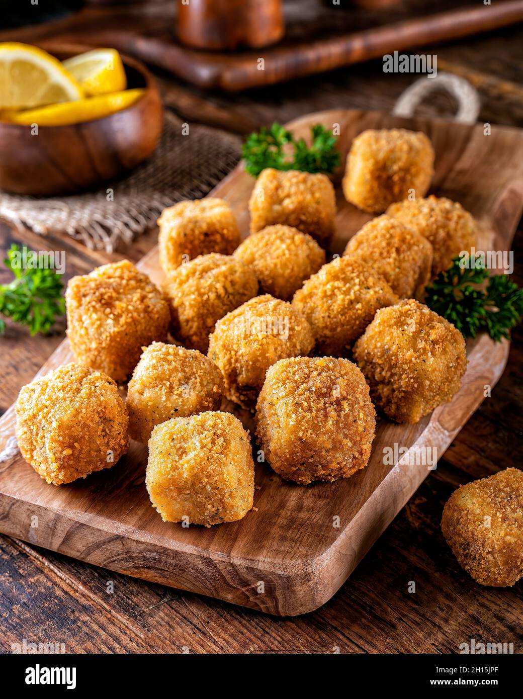 Delicious breaded fish nugget snacks on a rustic wood table top Stock ...