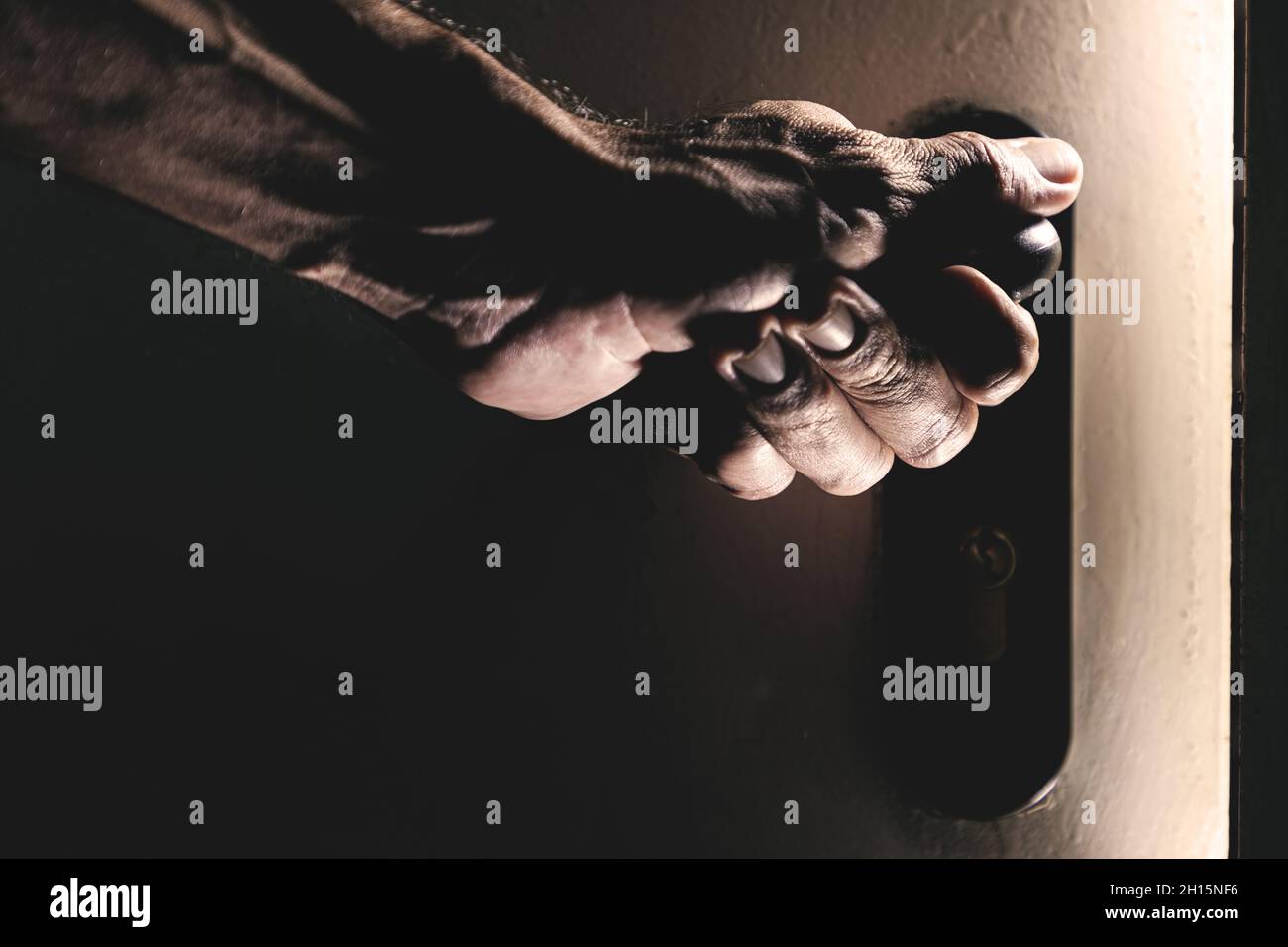 Male hand opening a wooden door with a metal handle Stock Photo - Alamy
