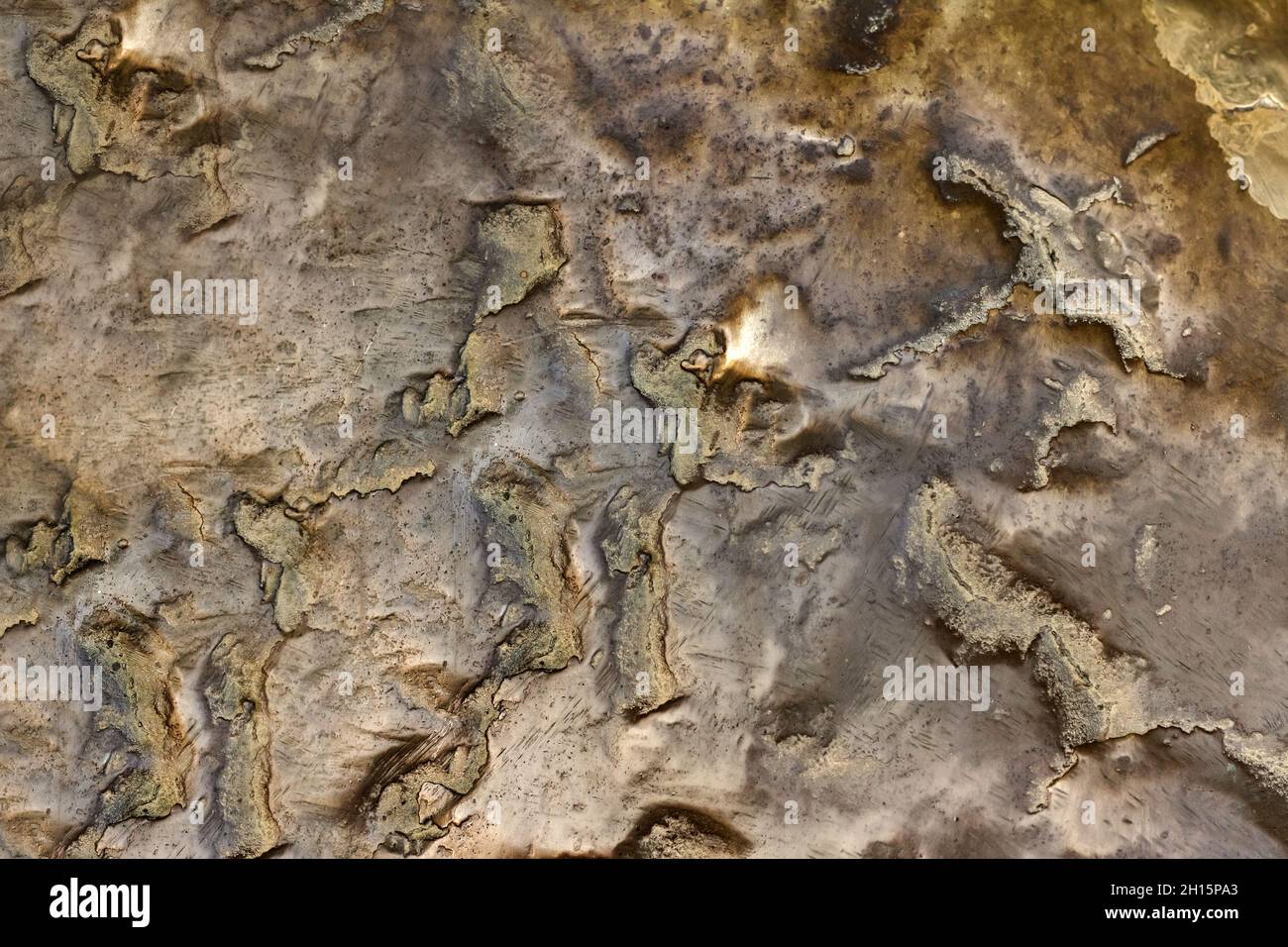 Close-up photo texture of copper or bronze statue material with folds ...