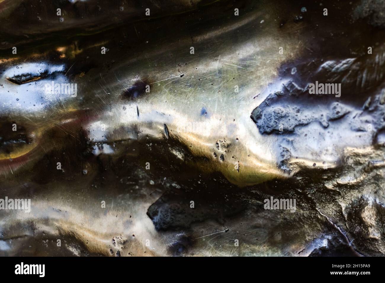 Close-up photo texture of copper or bronze statue material with folds ...