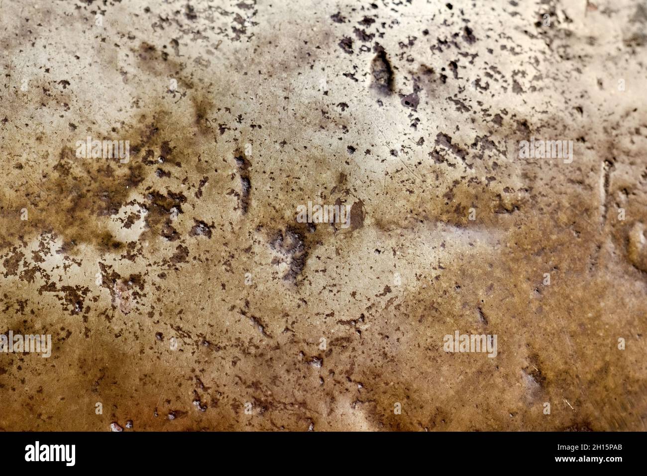 Close-up photo texture of copper or bronze statue material with folds ...