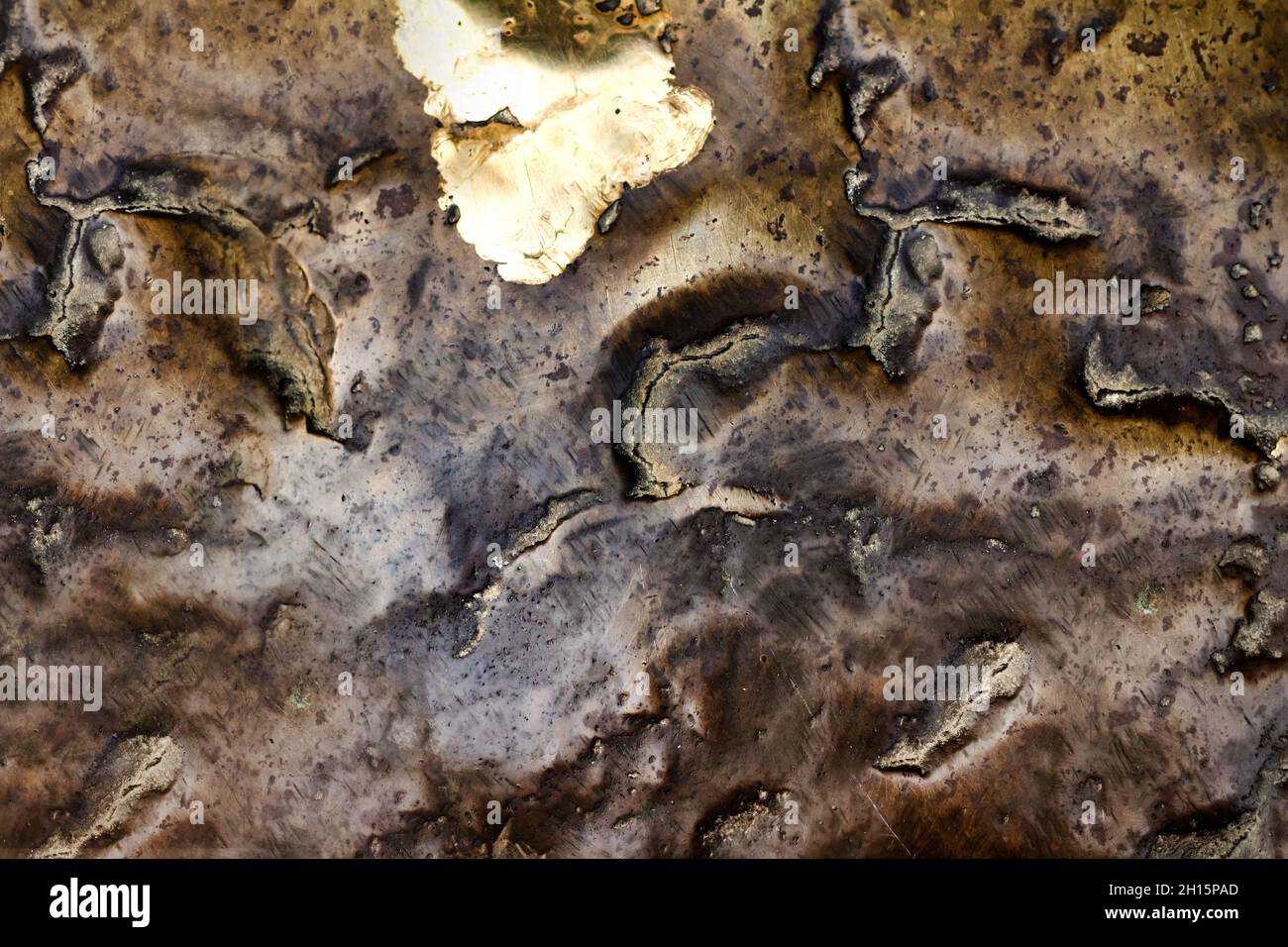 Close-up photo texture of copper or bronze statue material with folds ...