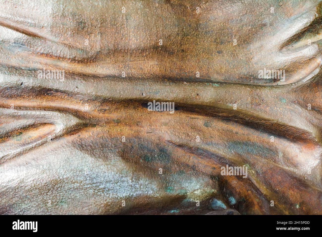 Close-up photo texture of worn and aged copper or bronze statue ...