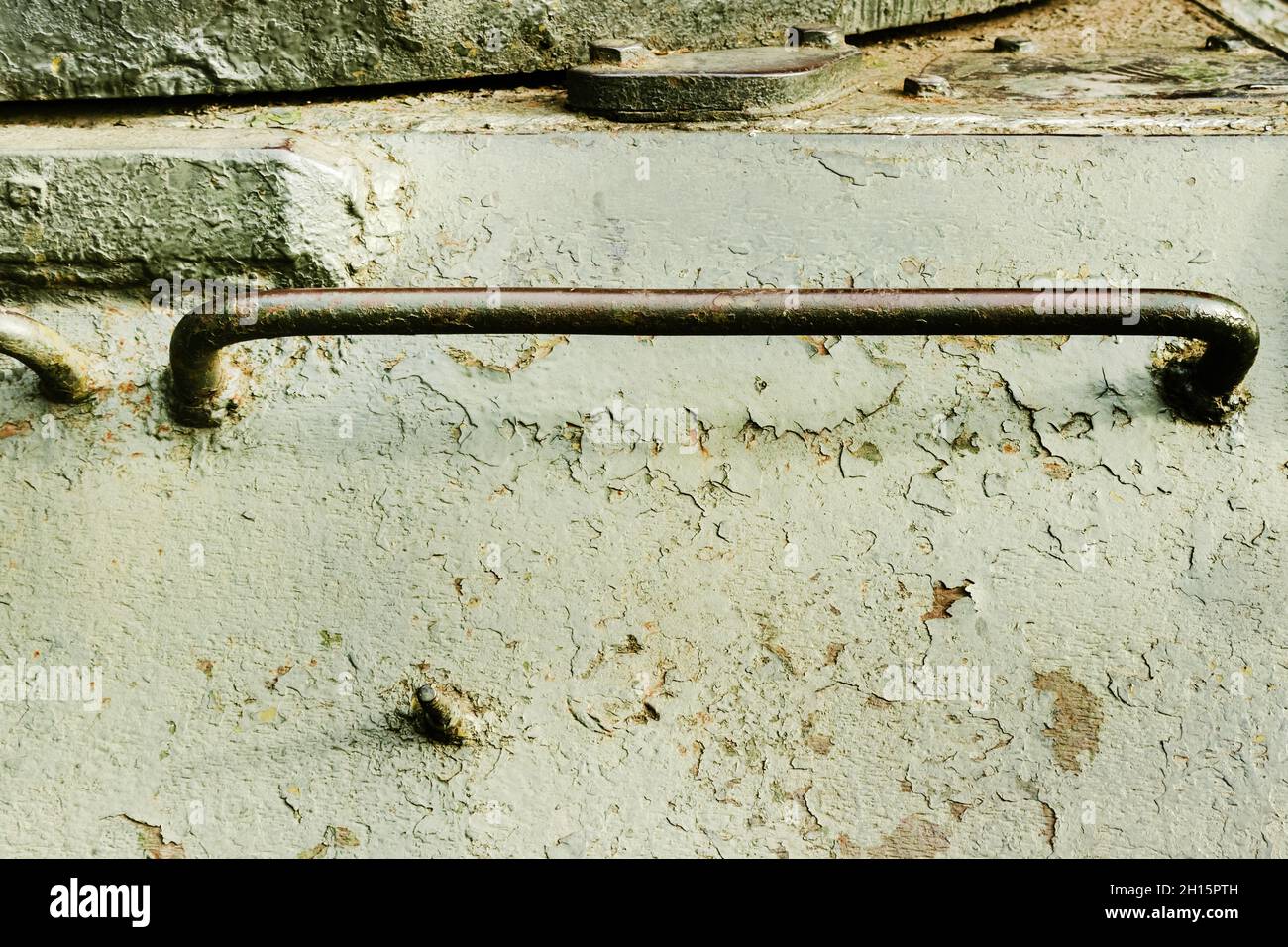 Photo of old and rusty green colored military vehicle armored surface with handle Stock Photo ...
