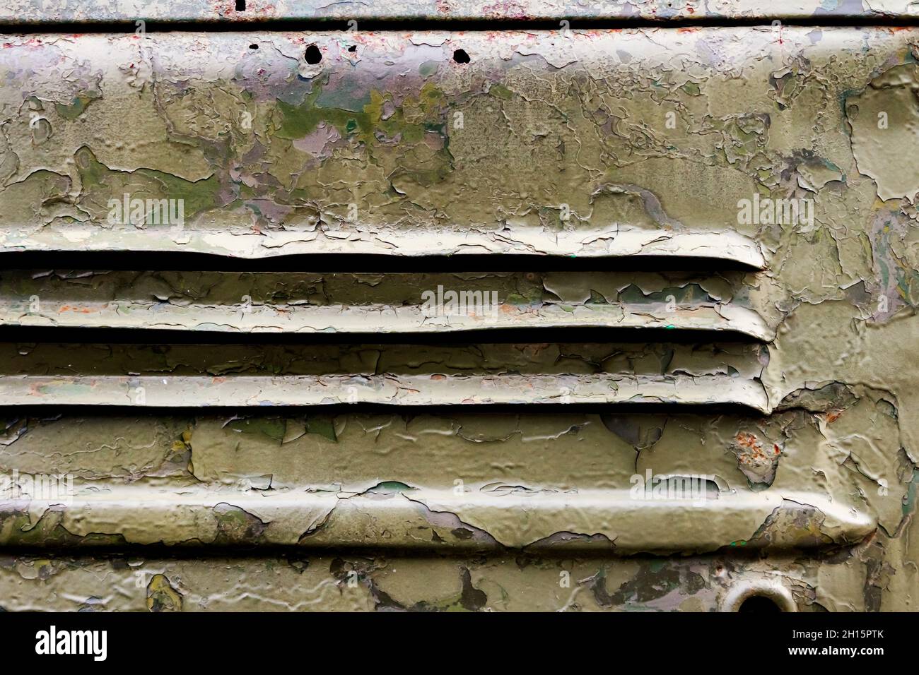 Photo of old and rusty green colored military vehicle armored surface ventilation Stock Photo ...