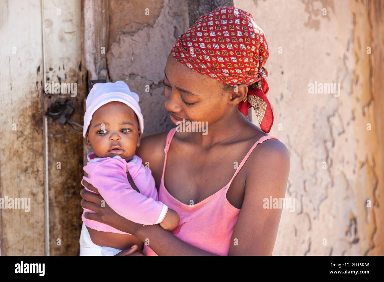 Single young African mother in a village in Botswana, the drama of ...