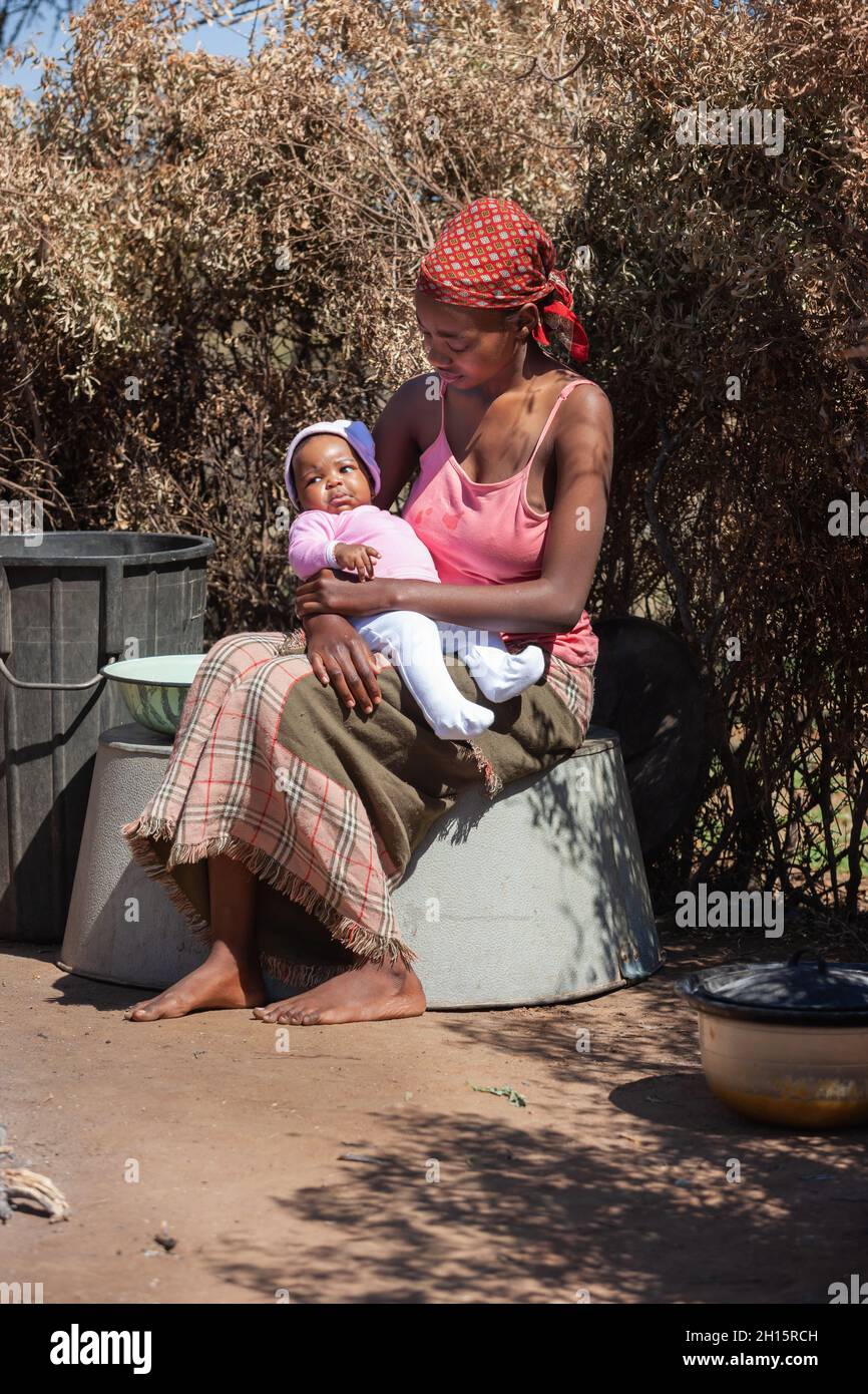 Single young African mother in a village in Botswana, the drama of ...