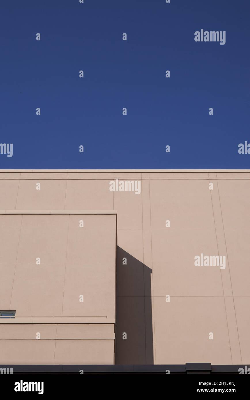 a deep blue sky above a bright, sunlit building Stock Photo - Alamy