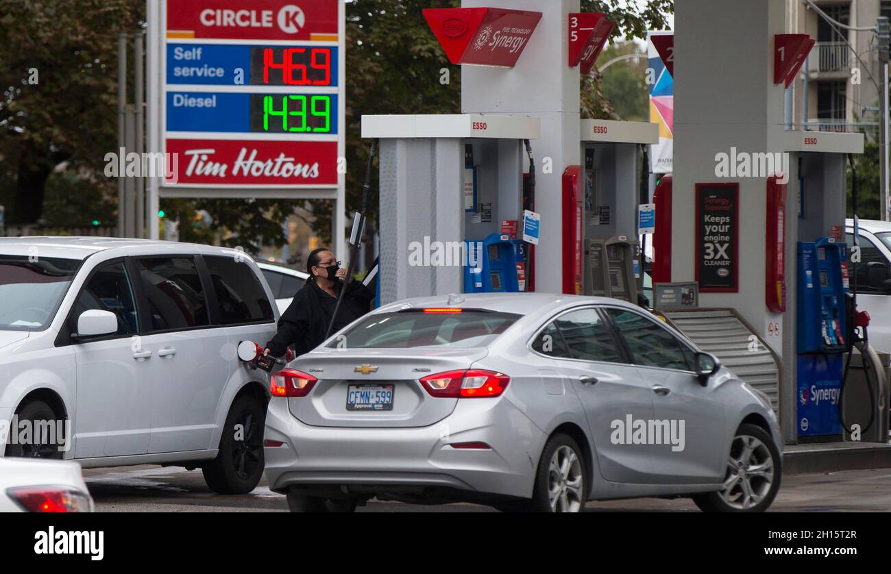 Toronto, Canada. 16th Oct, 2021. A man fuels a vehicle at a gas station ...