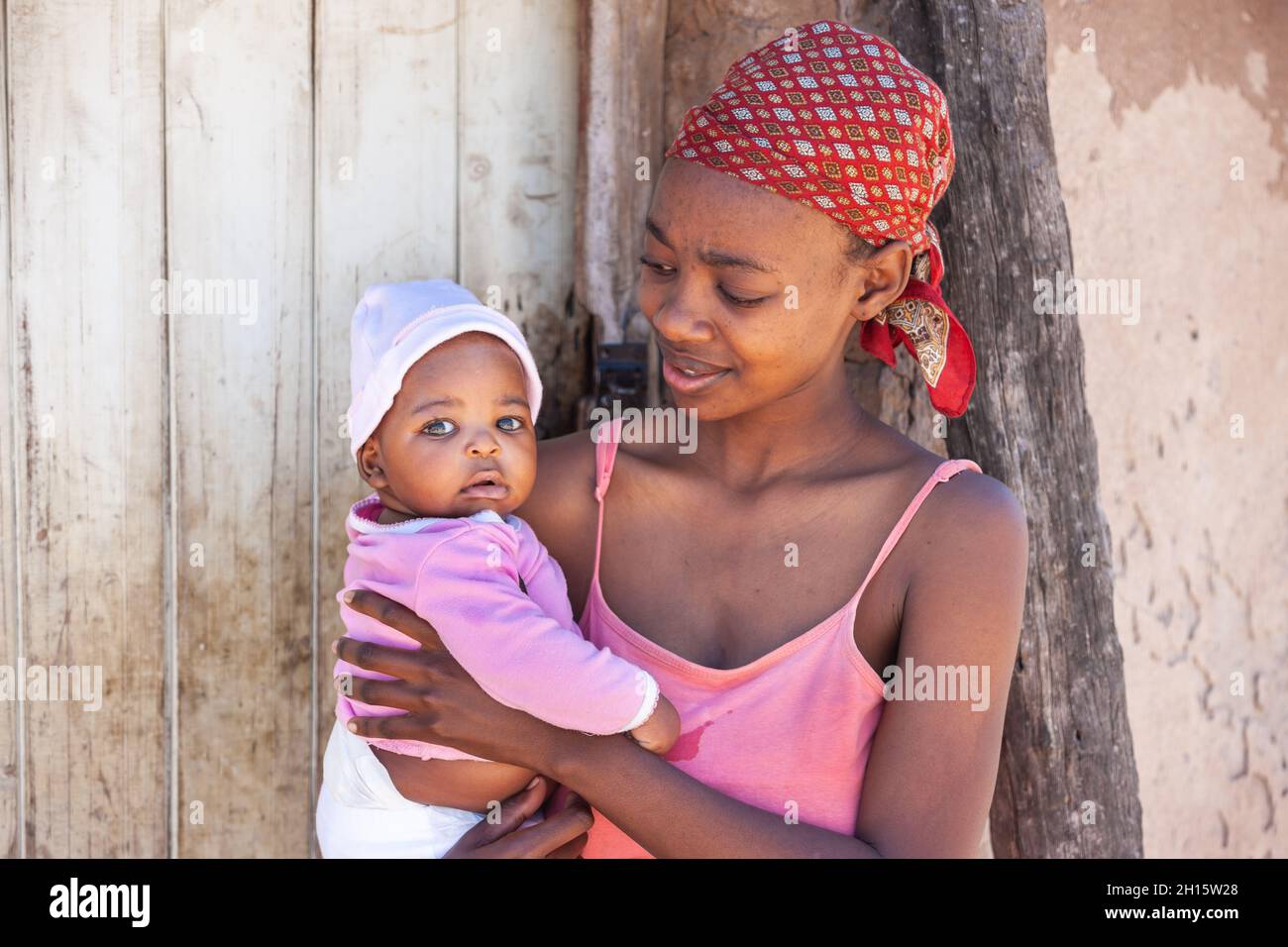 Single young African mother in a village in Botswana, the drama of ...