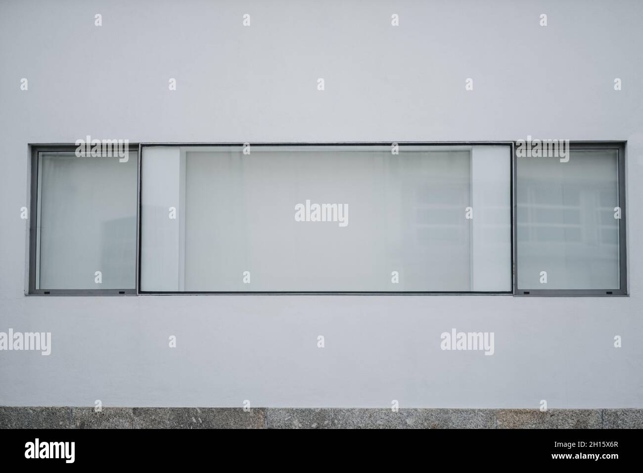 Long window on a white building exterior Stock Photo - Alamy