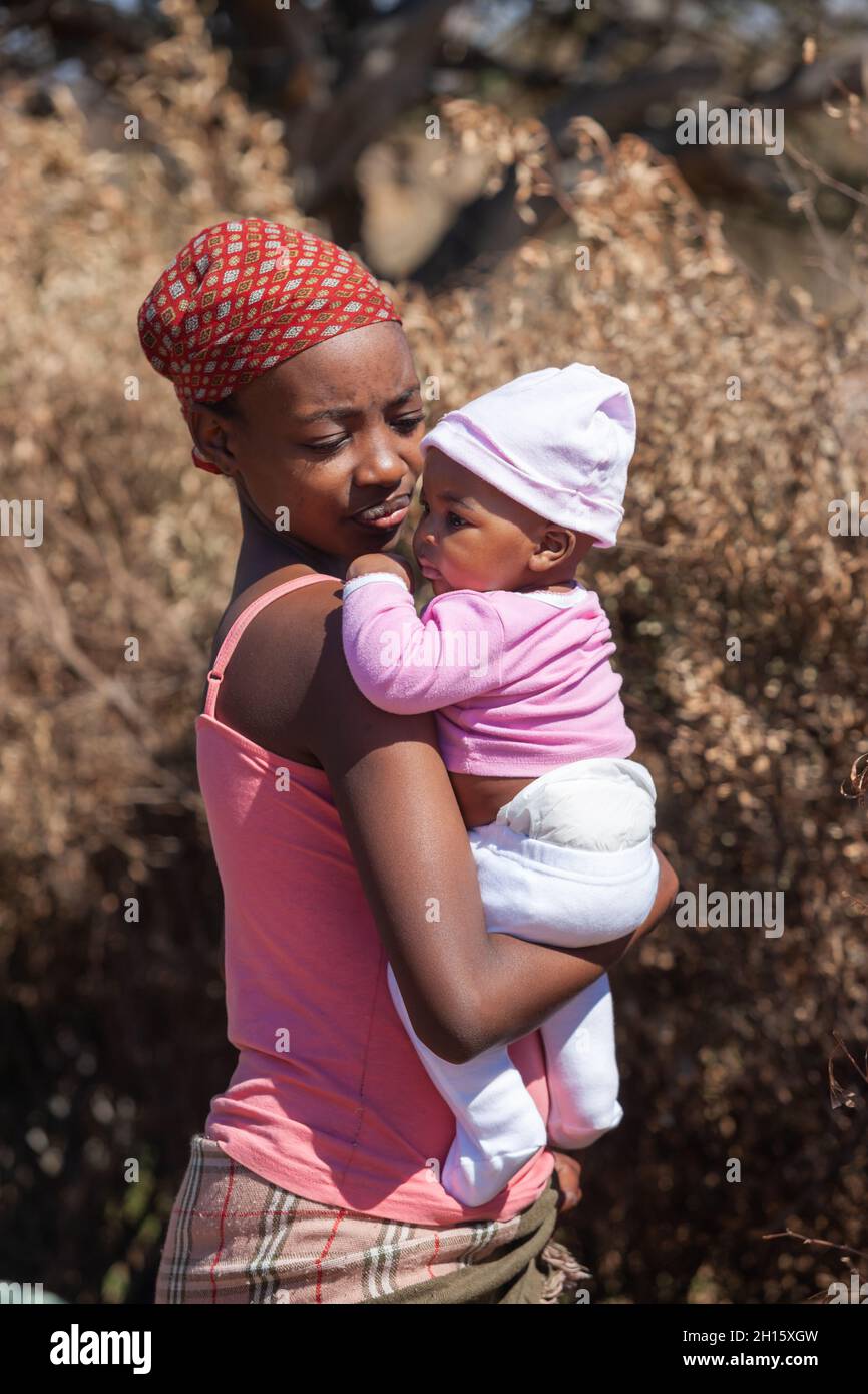 Single young African mother in a village in Botswana, the drama of ...