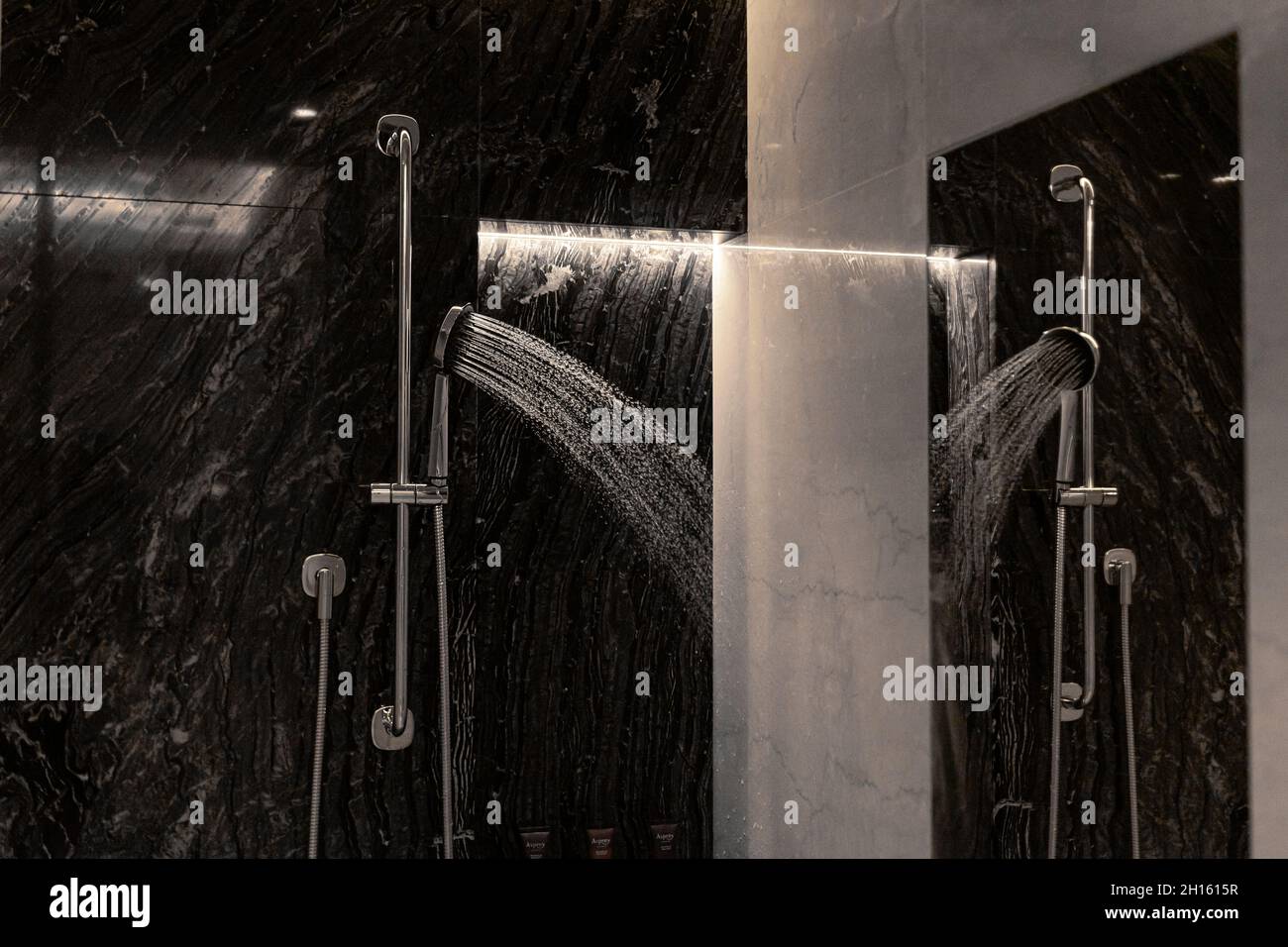 Luxurious room shower sprinkling water on the bathroom wall Stock Photo ...