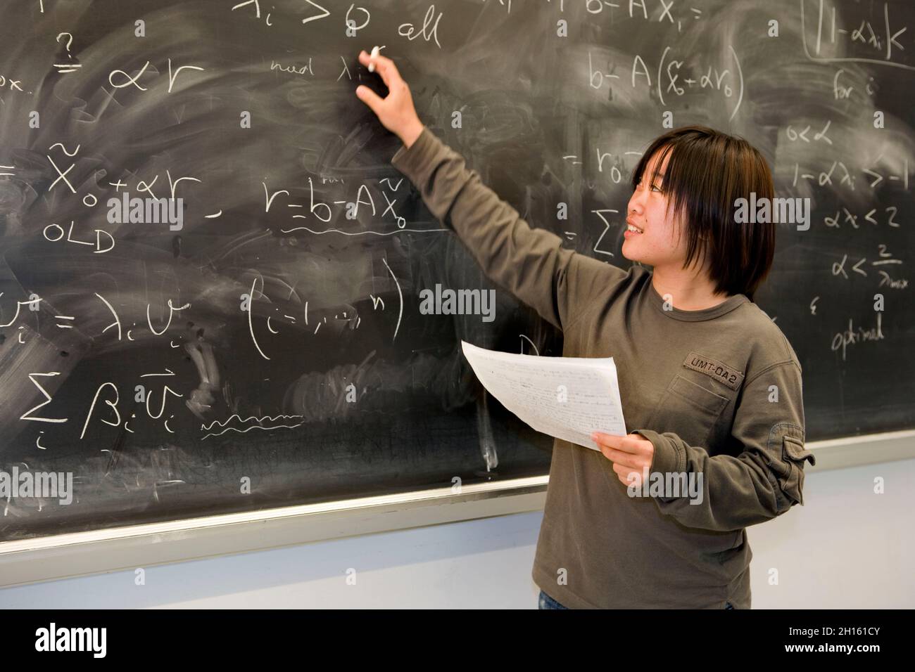 Chinese student at blackboard-math class MR - Model Released Stock ...