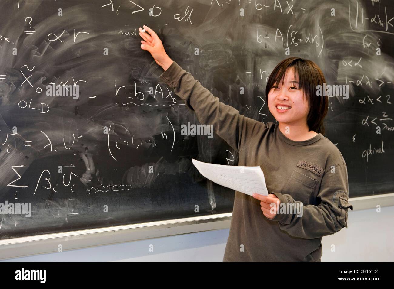Chinese student at blackboard in a math class MR - Model Released Stock ...
