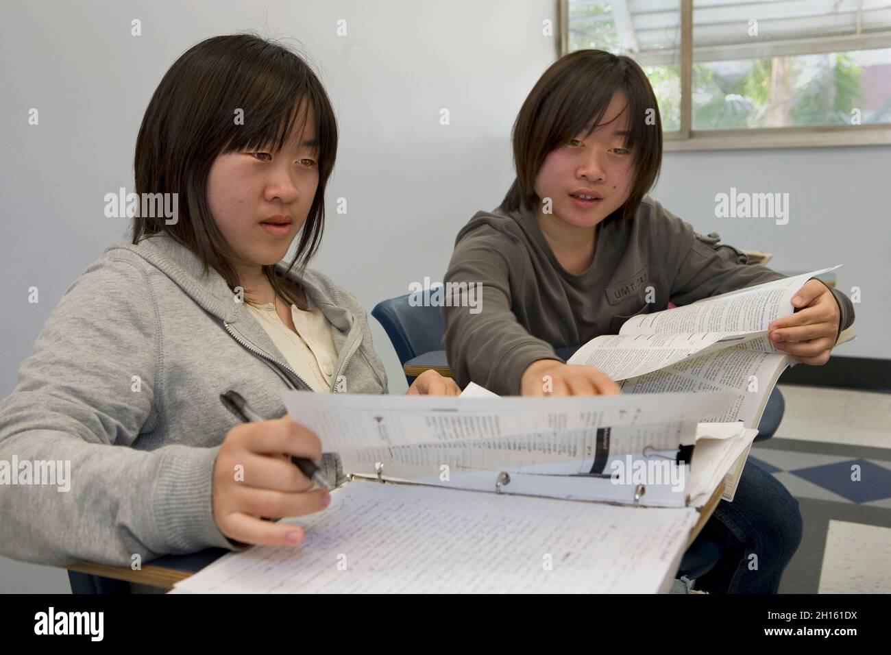 Chinese students do homework in class MR - Model Released Stock Photo ...