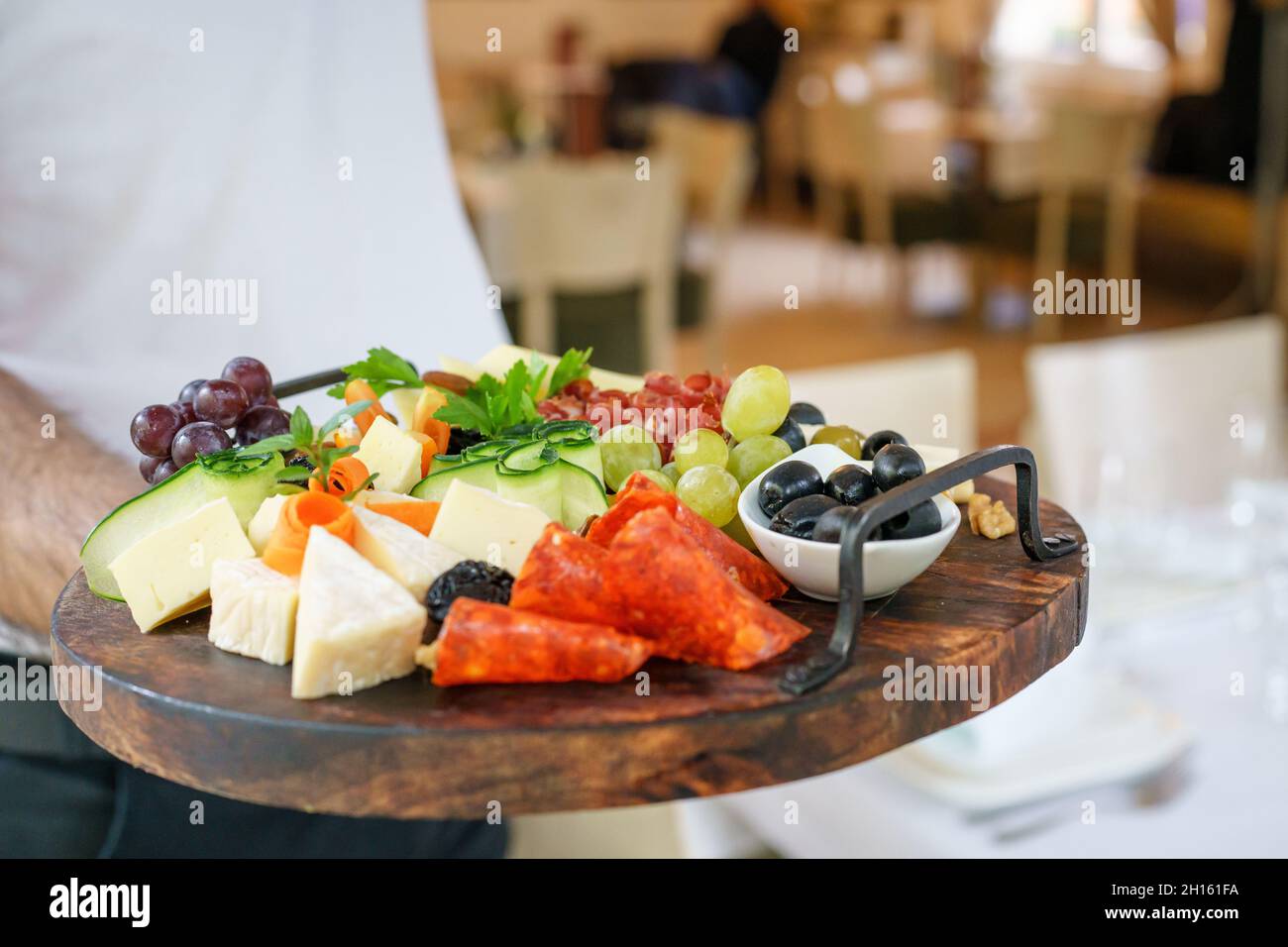 Waiter serving food restaurant hi-res stock photography and images - Alamy