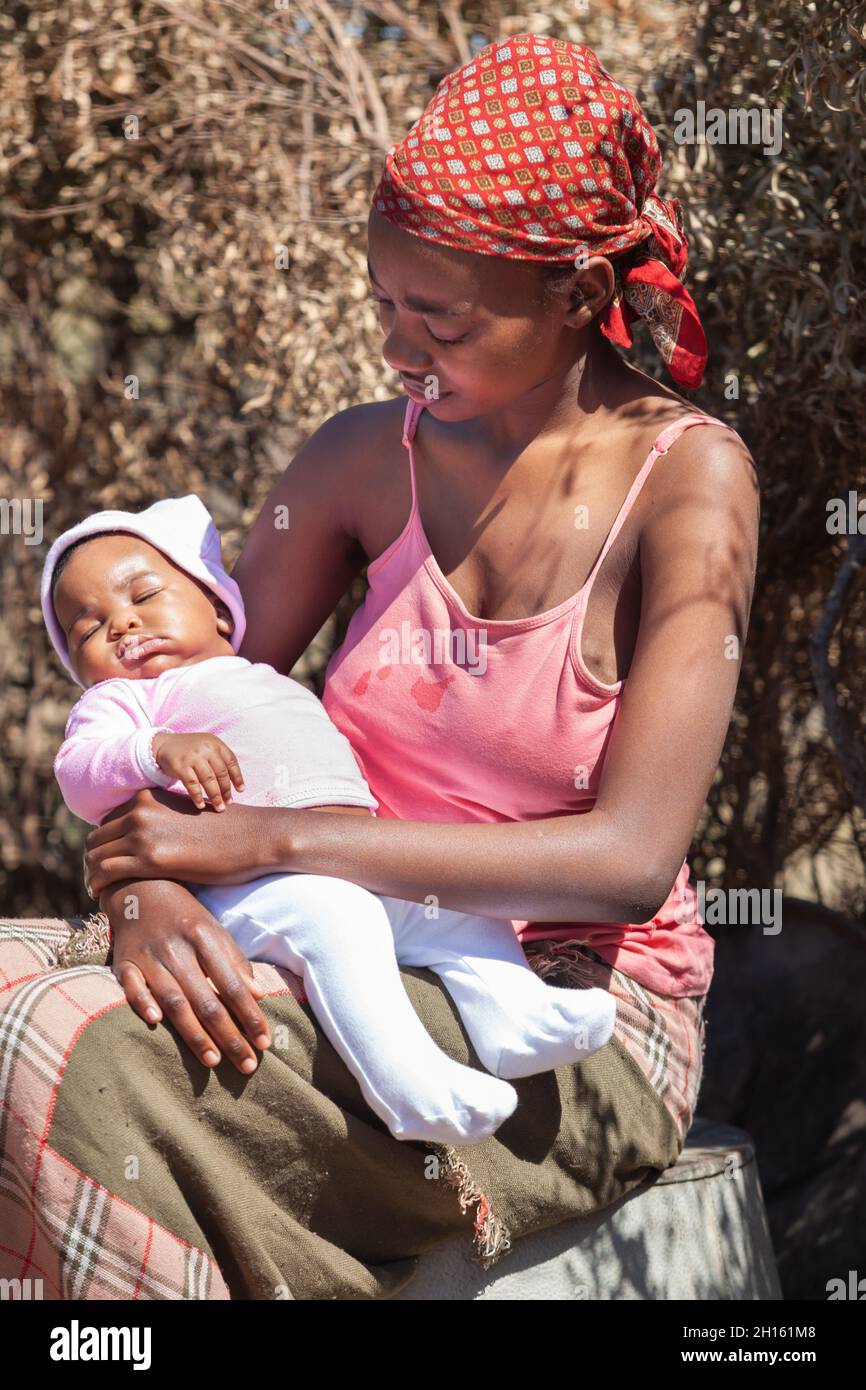 Single young African mother in a village in Botswana, the drama of ...