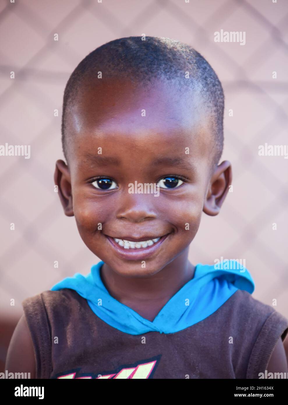 African child portrait in a village in Botswana standing in front of ...