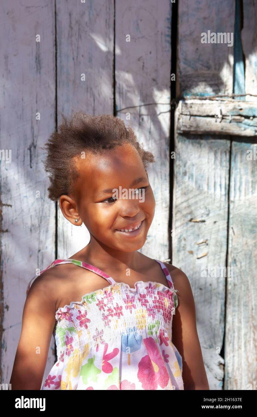 African child portrait in a village in the rural Botswana standing in ...