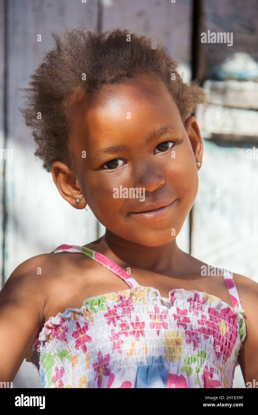 African child portrait in a village in the rural Botswana standing in ...