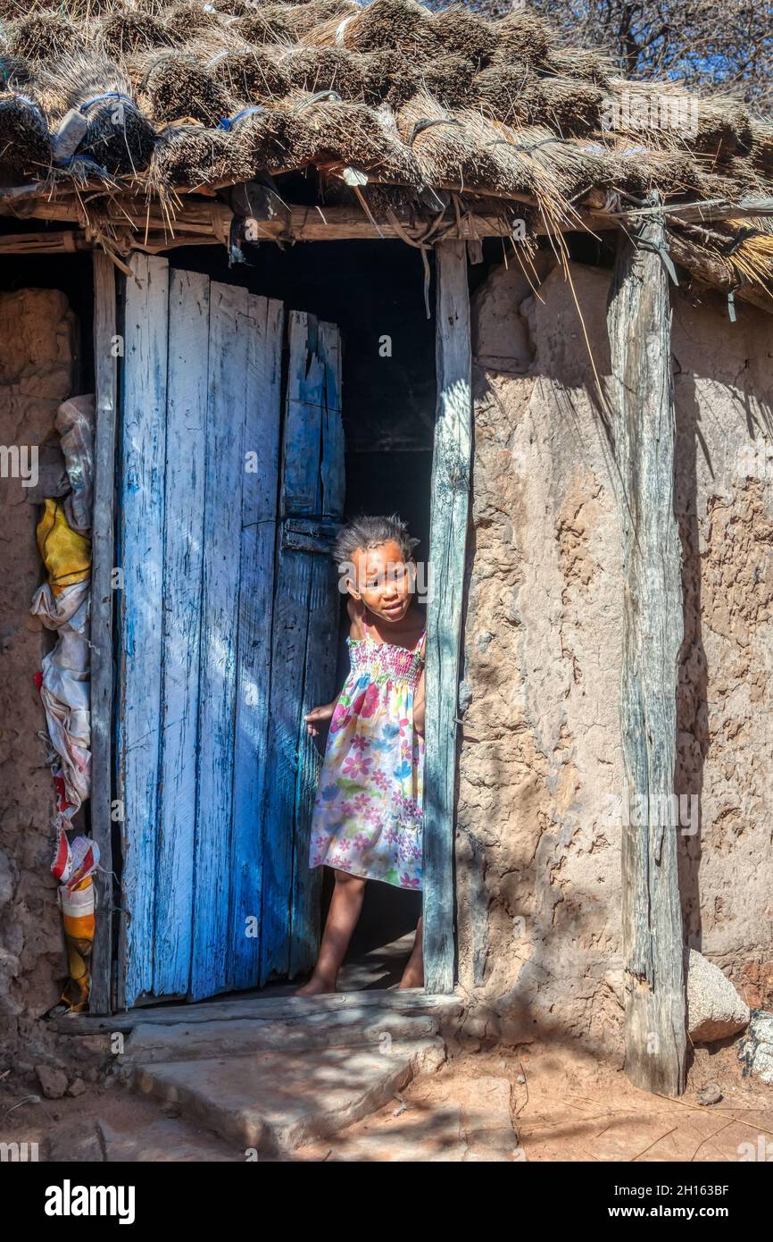 African child portrait in a village in the rural Botswana standing in ...