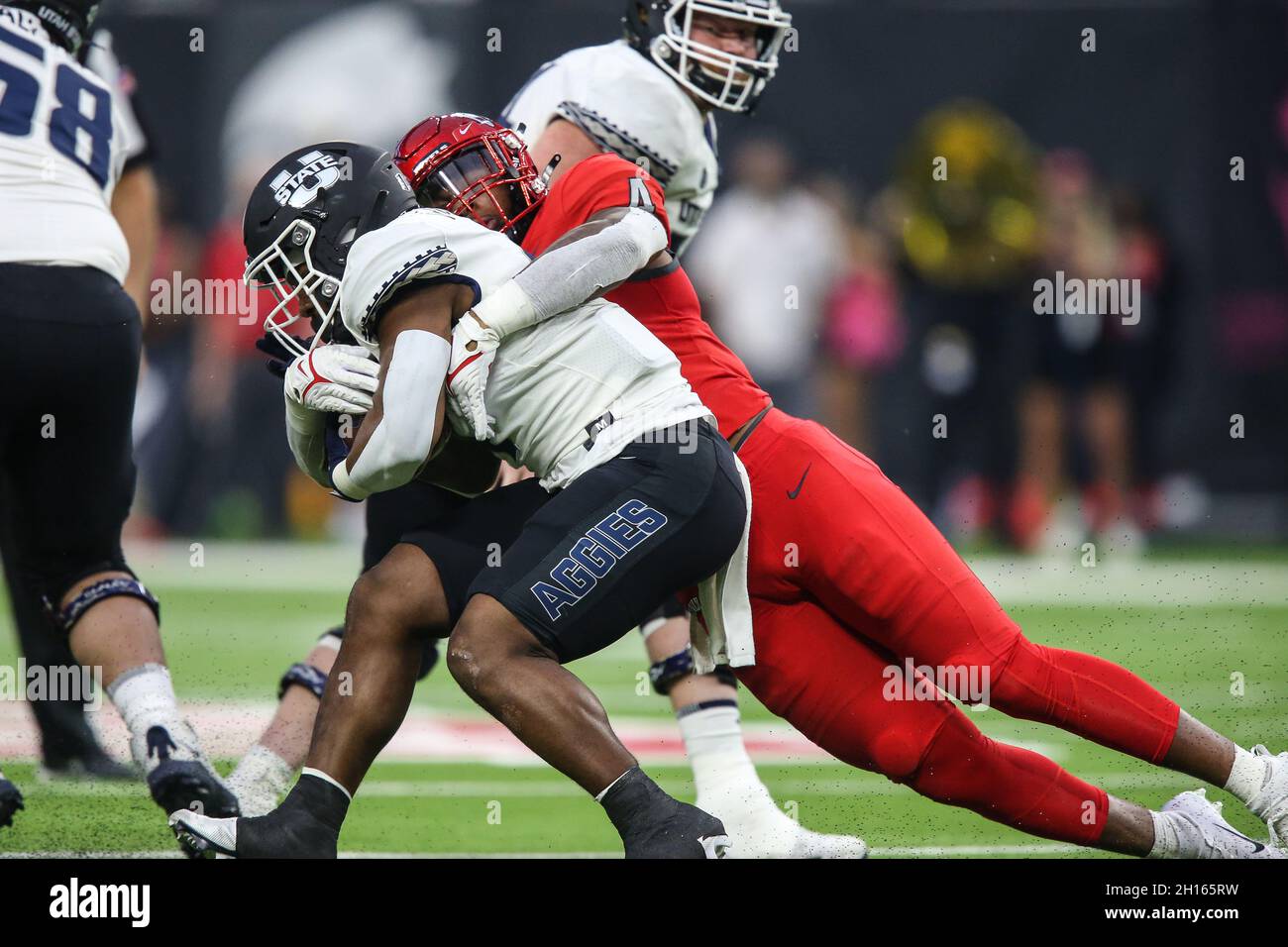 October 16, 2021: UNLV Rebels linebacker Jacoby Windmon (4) tackles ...