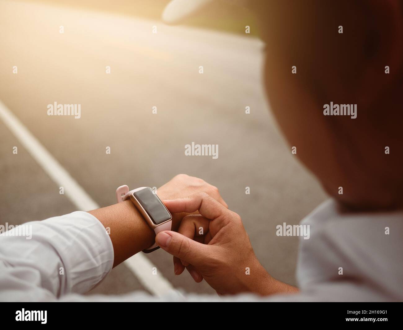 Female runners looking at smart watch heart rate monitor. Athlete ...
