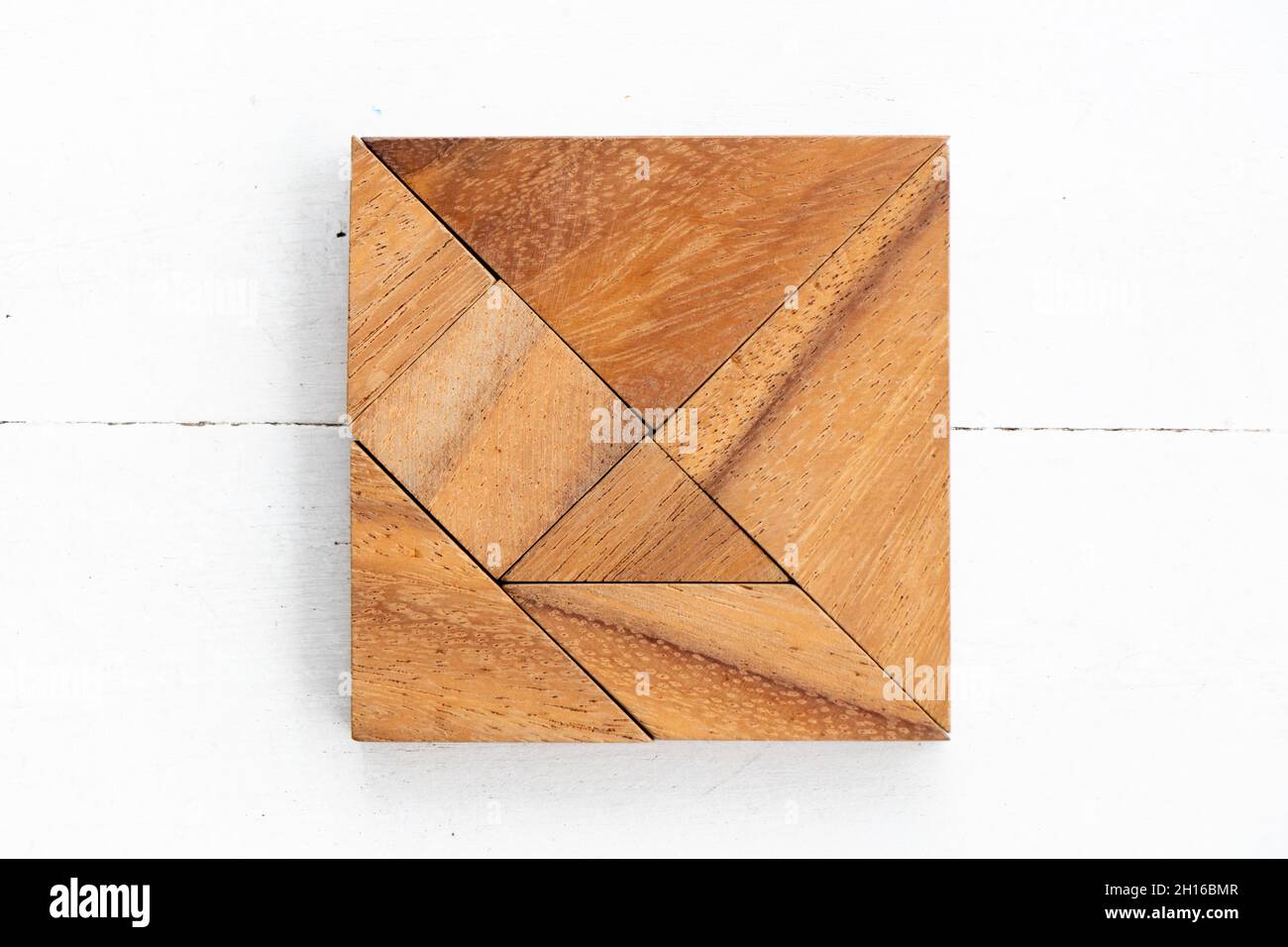 Wood tangram puzzle in square or rectangle shape on white wood ...