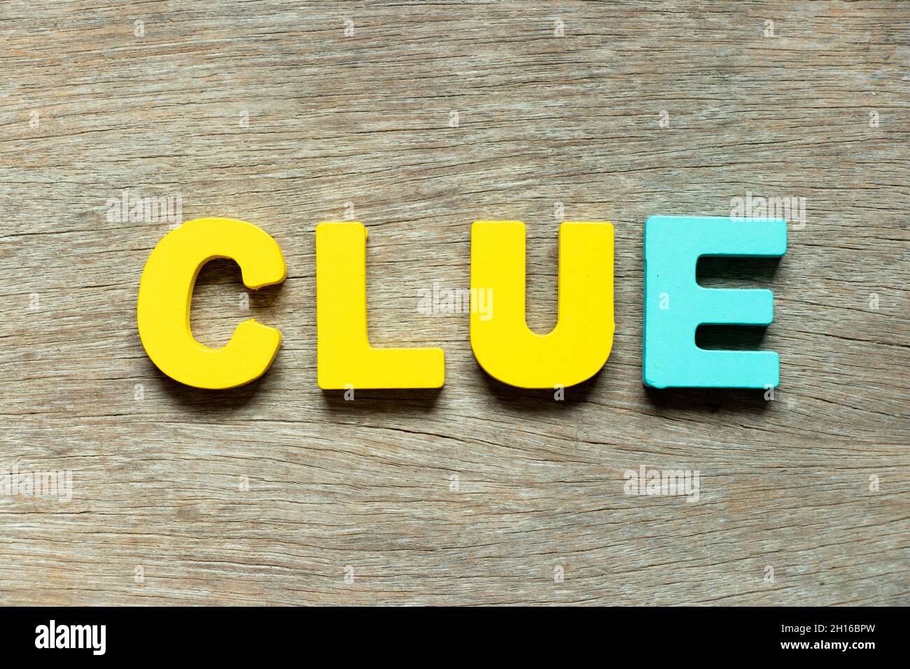 Color alphabet letter in word clue on wood background Stock Photo - Alamy